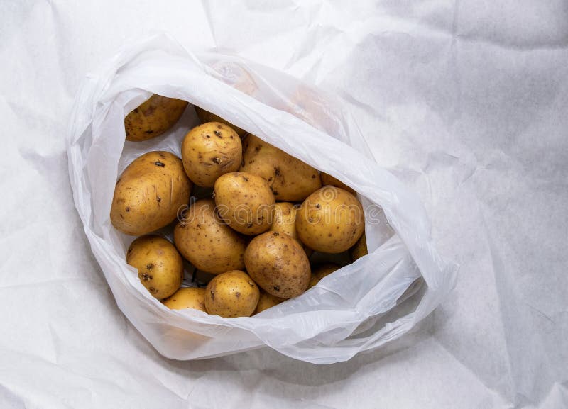 A Pile of Unwashed Potatoes Lies in a Bag Stock Photo - Image of ...