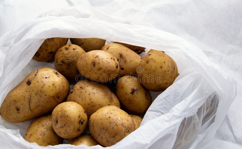 A Pile of Unwashed Potatoes Lies in a Bag Stock Photo - Image of chips ...