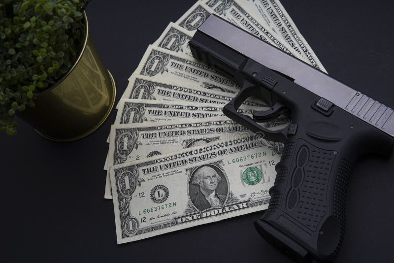 Pile of US Dollar Cash and a Black Gun. Stock Photo - Image of dollar ...