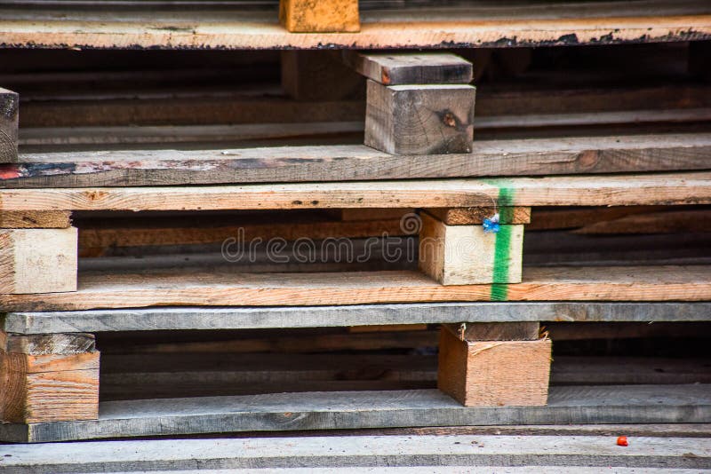 A Pile of Wooden Pallet Dumped in the Grass Stock Image - Image of ...