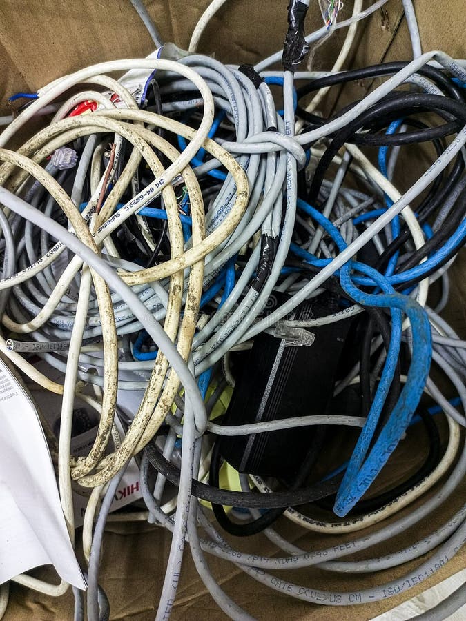 Pile of Cables is Hanging from a Fuse Box Placed on the Wall of ...