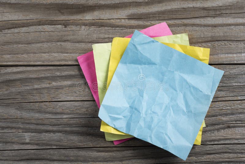 Pile of Various Crumpled Multi Colored Note Papers on an Old Wooden ...