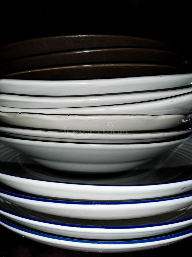 Pile of Plates on the Table Stock Image - Image of bumper, table: 236102713