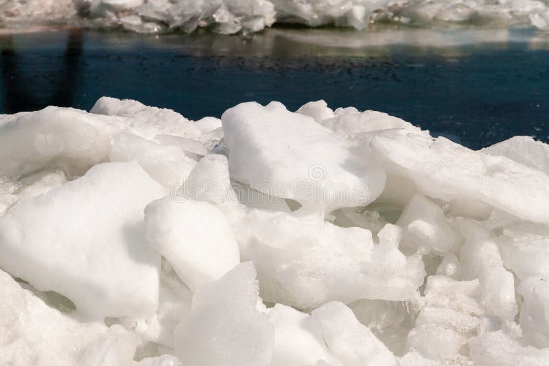 A Pile of White Ice Against the Water Stock Photo - Image of natural ...
