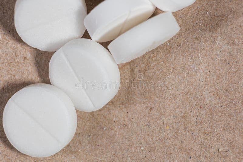 A Pile of White Pills Lie on a Craft Paper Stock Photo - Image of craft ...