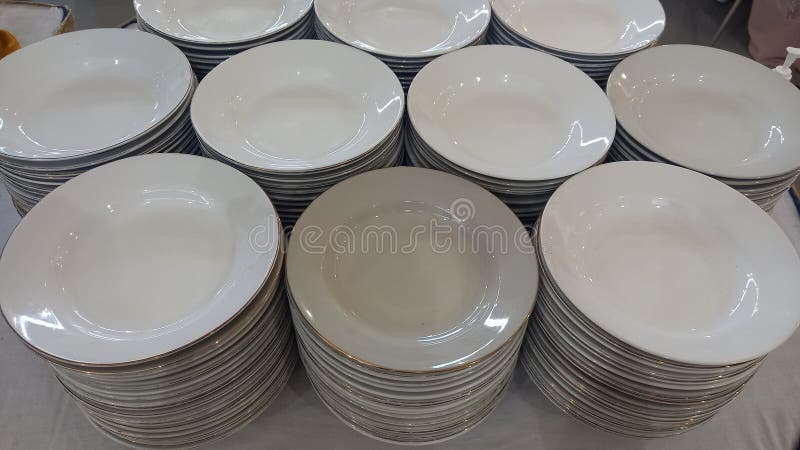 Pile of White Porcelain Plates on the Table Stock Image - Image of ...