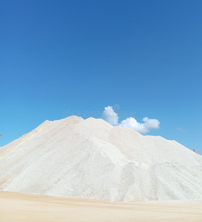 A Pile of White Sand Material on a Sky Blue Background Stock Photo ...