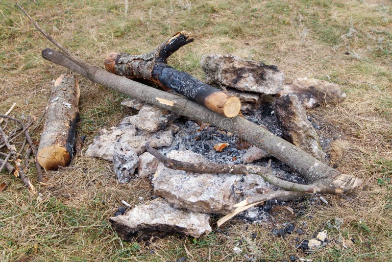 A Pile of Wood and Rocks with a Stick in the Middle Stock Photo - Image ...