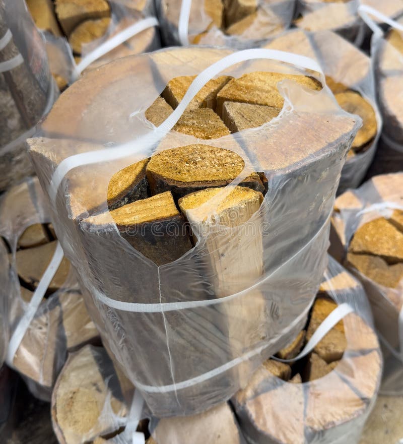 A Pile of Wood is Wrapped in Plastic and Tied with a String Stock Image ...