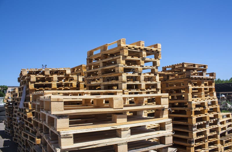 Pile of wooden pallets stock photo. Image of ladies - 374728874