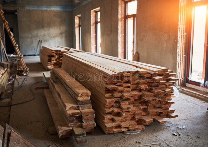A Pile of Wooden Planks at a Construction Site Stock Image - Image of ...