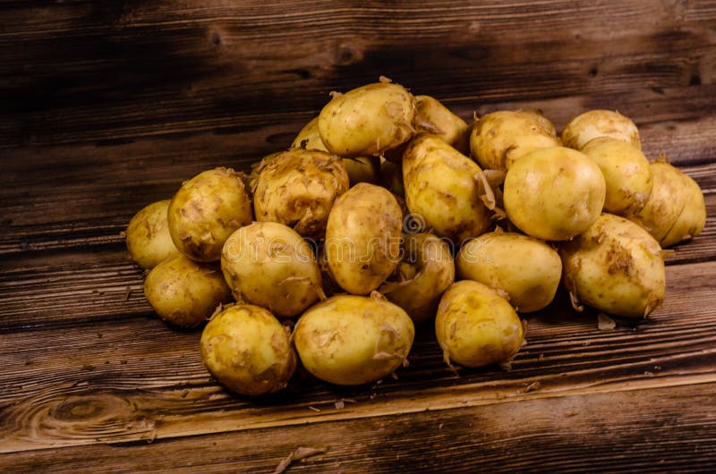 Pile of the Young Potato on Wooden Table Stock Image - Image of grocery ...