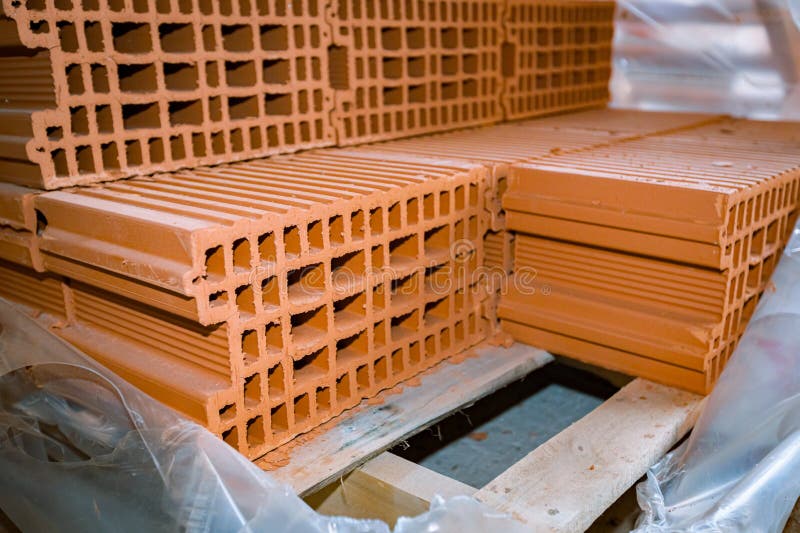 Piled Red Blocks, Packed in Opened Plastic Foil Stock Photo - Image of ...