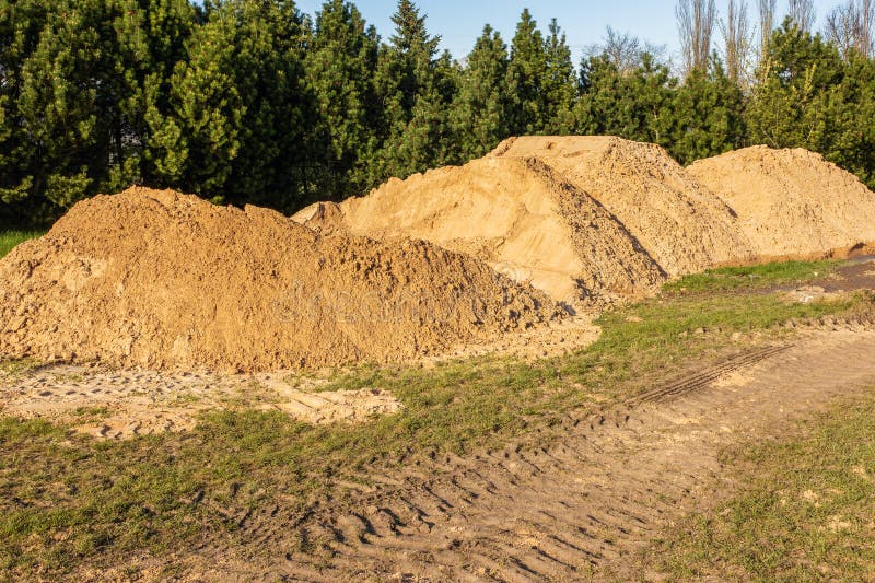 Piles of Construction Sand are Poured Outside Stock Photo - Image of ...
