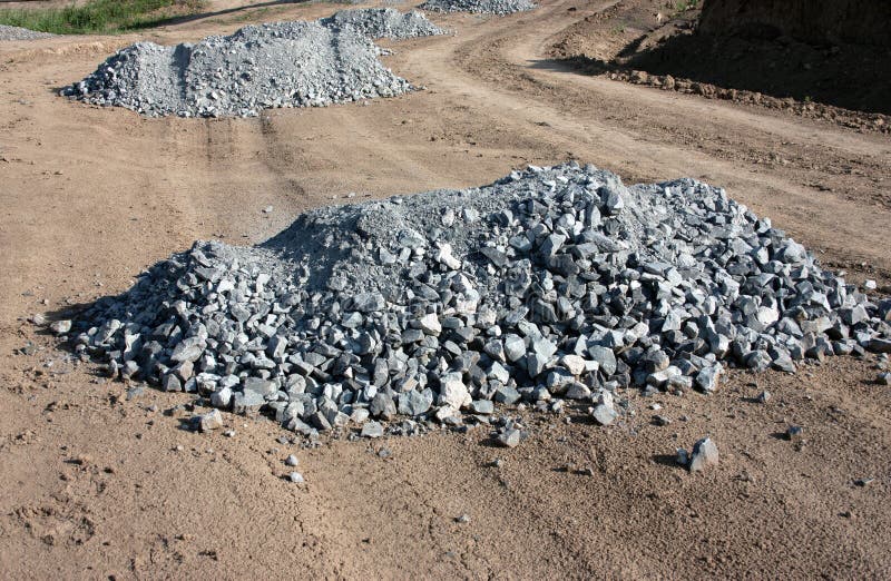 Piles of Granite Rubble are Scattered on the Ground. Start of Road ...