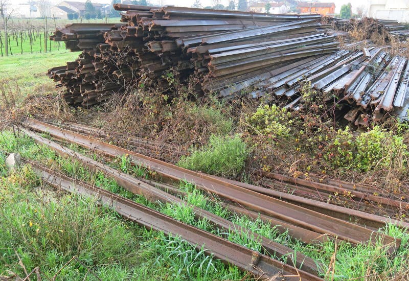 Piles of Many Long Pieces of Iron Used for Train Rails Stock Image ...