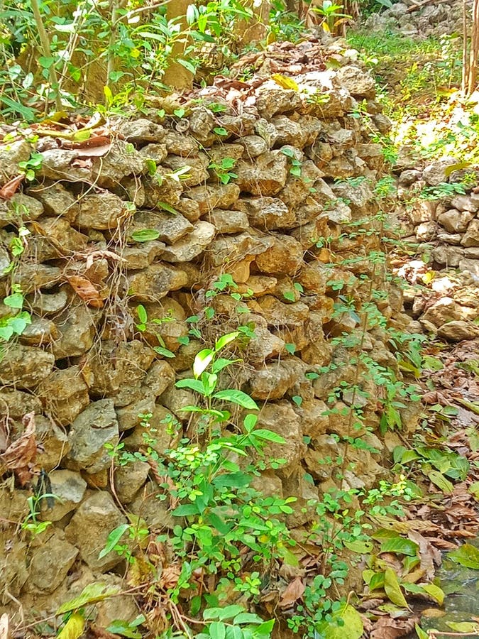 Piles of River Stones are Piled Up and Sideways As Traditional Canal ...