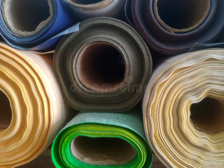 Piles of Rolls of Textile Fabrics of Various Colors Stock Photo - Image ...