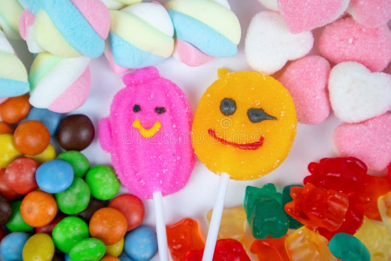 Piles of Various Kinds of Sweets and Candies with a Focus on the ...