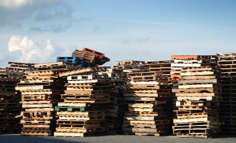 Piles of wooden pallets stock image. Image of shipping - 5556553