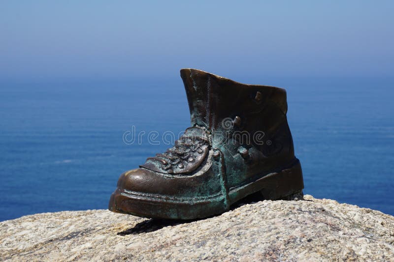 Boot Pilgrim on the Lighthouse of Cape Finisterre, Galicia, Spain Stock ...