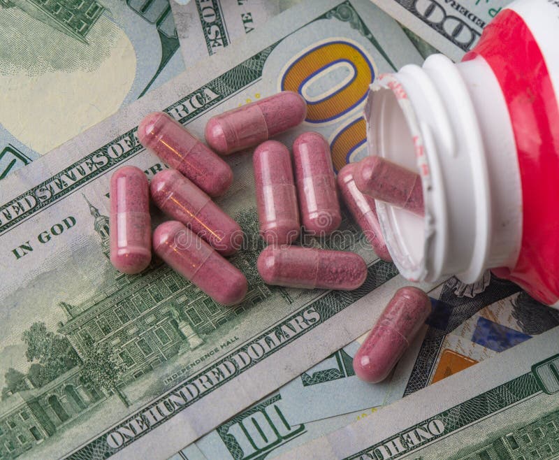 Money and Pills in a Bottle with a Stethoscope Stock Photo - Image of ...