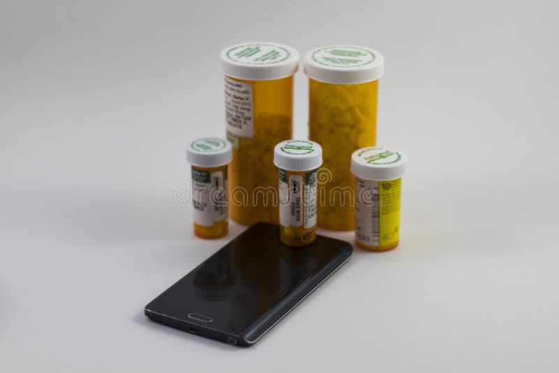 Pill Bottles and a Cell Phone Stock Photo - Image of capsule, color ...