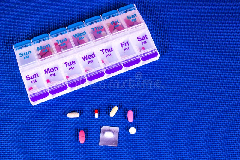 Pill Box Container on Blue Pattern Background Stock Photo - Image of ...