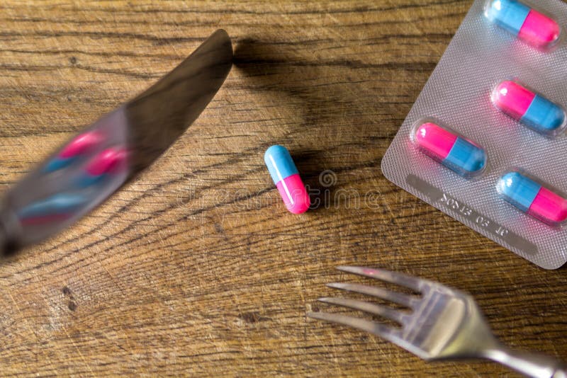 Pill and cutlery stock image. Image of medicine, food - 48738501