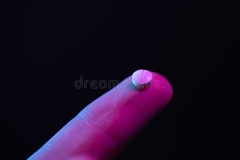 Small White Drug Tablet on the Tip of a Finger Stock Photo - Image of ...