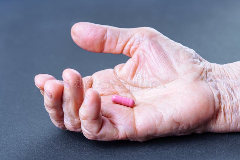 Pill in a Wrinkled Hand of an Old Human Stock Image - Image of fingers ...