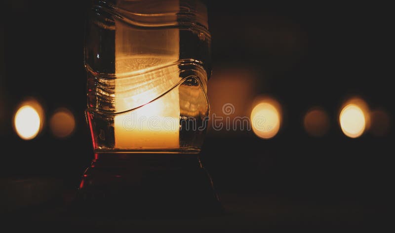 Pillar Candle Inside Glass Bottle Stock Photo - Image of blur ...