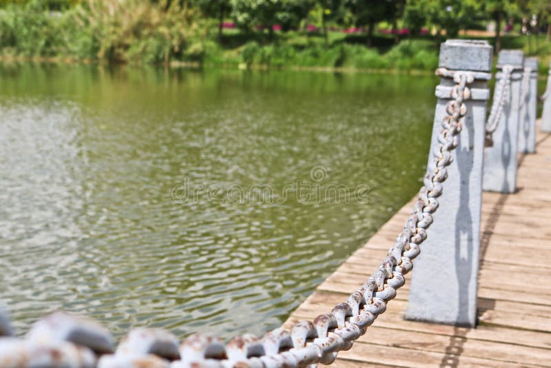 Pillar and Chain Fence Down on a Lake Side Stock Photo - Image of ...