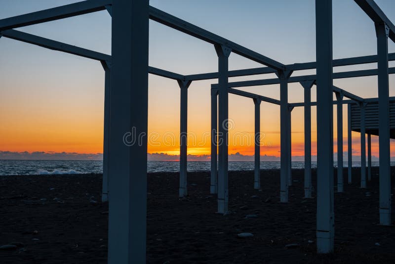 Pillars on the Shore during Sunset, Silhouettes of the Pillars of the ...