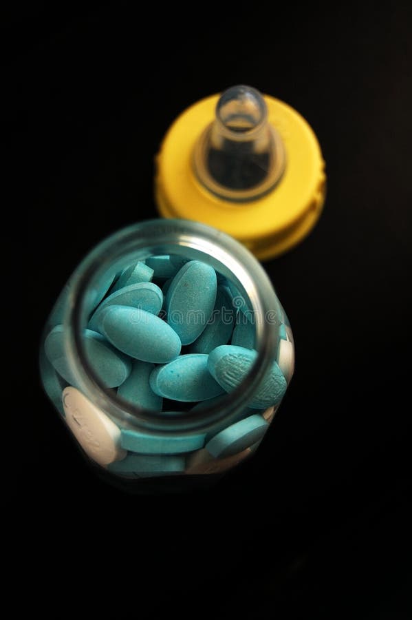 Pills in a baby bottle stock image. Image of milk, feeding - 6148077