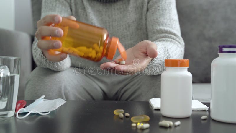 Pills, Capsules and Thermometer on the Table. Man Taking Medication ...