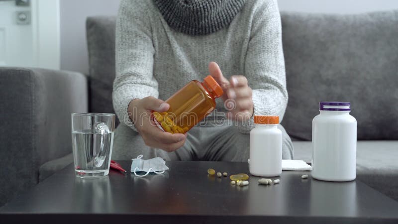 Pills, Capsules and Thermometer on the Table. Man Taking Medication ...