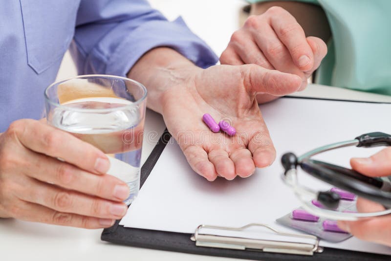 Senior Man Taking Medication with Water Stock Photo - Image of ...