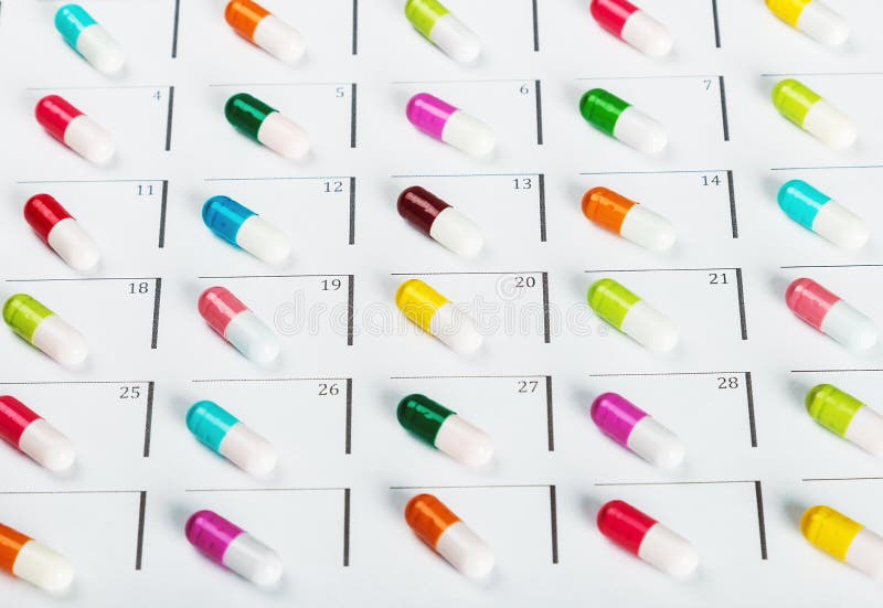 Pills are of Different Color on the Calendar Stock Photo - Image of ...