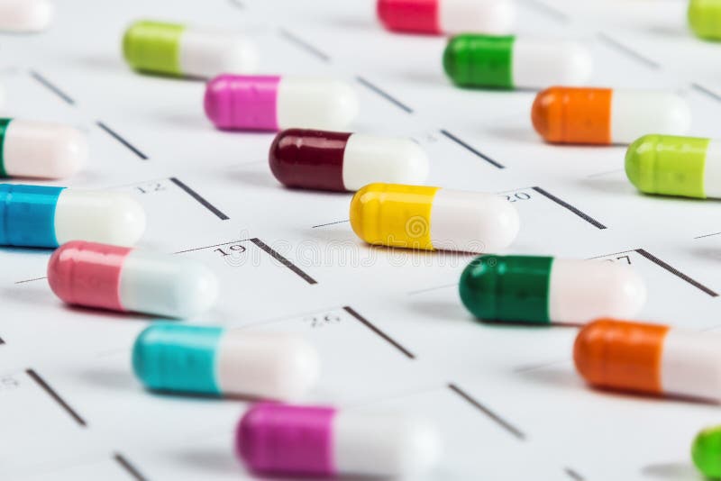Pills are of Different Color on the Calendar Stock Photo - Image of ...