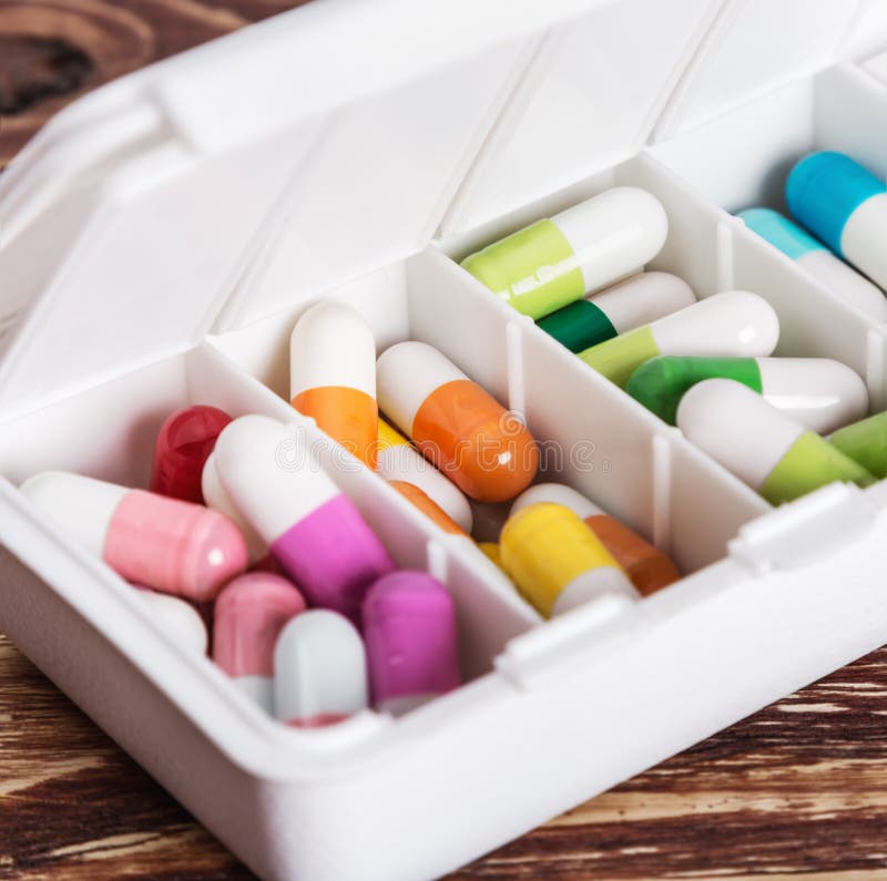 Pills of Different Colors in a Box Stock Photo - Image of group ...