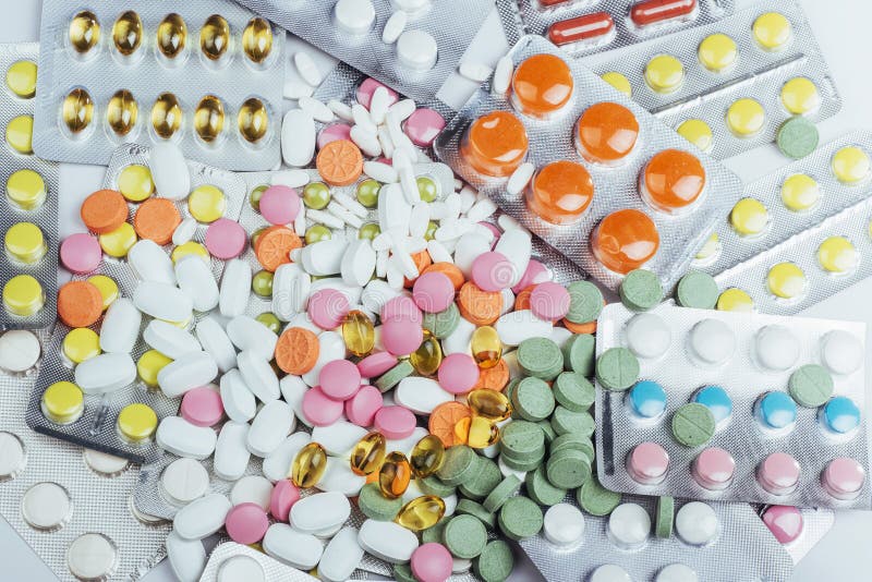 Pills of Different Colors Lie on the Surface in a Sealed Package. Stock ...