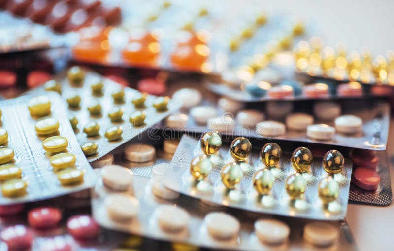 Pills of Different Colors Lie on the Surface in a Sealed Package. Stock ...