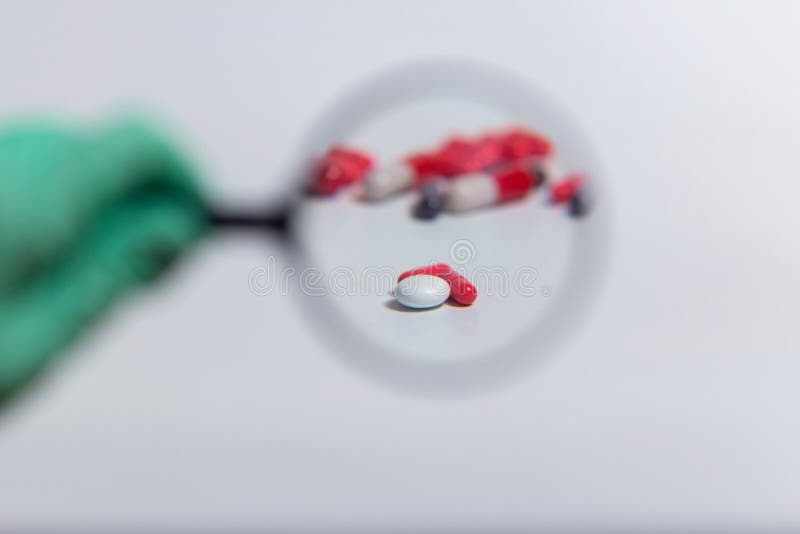 Pills / Drugs through Magnifying Glass Stock Image - Image of observe ...