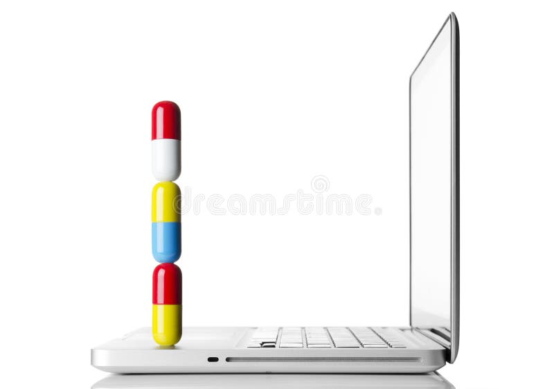 Pills on laptop stock image. Image of capsules, studio - 24561545