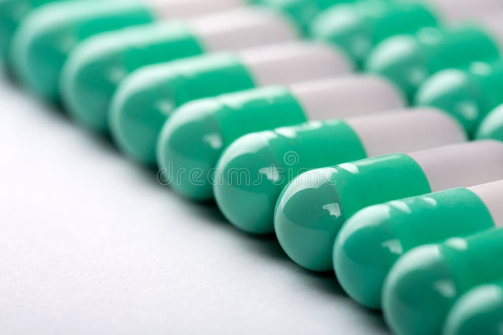 Pills in a row stock photo. Image of medical, dragee - 26315398