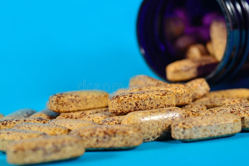 Pills Spill Out from Bottle on a Blue Stock Photo - Image of addiction ...