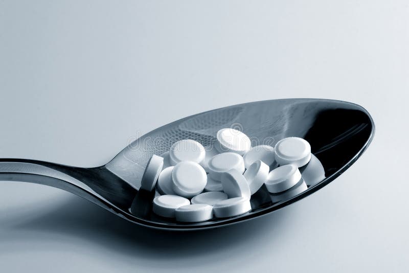 Pills on the spoon stock photo. Image of curing, indoor - 12828
