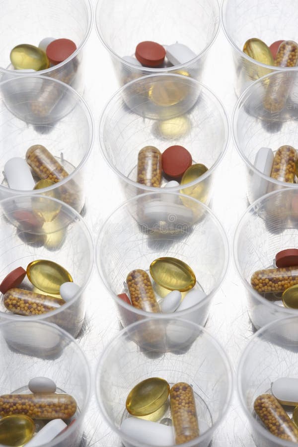 Pills and Tablets in Plastic Cups Stock Photo - Image of large, london ...