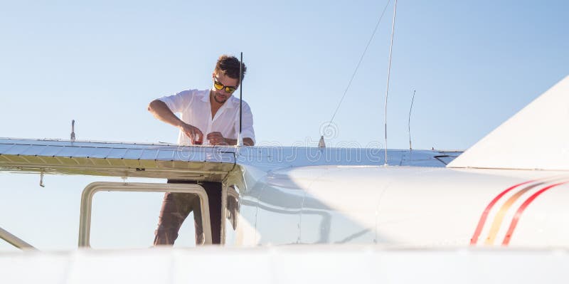 Pilot with Airplane Checking Fuel Level Stock Image - Image of outdoor ...